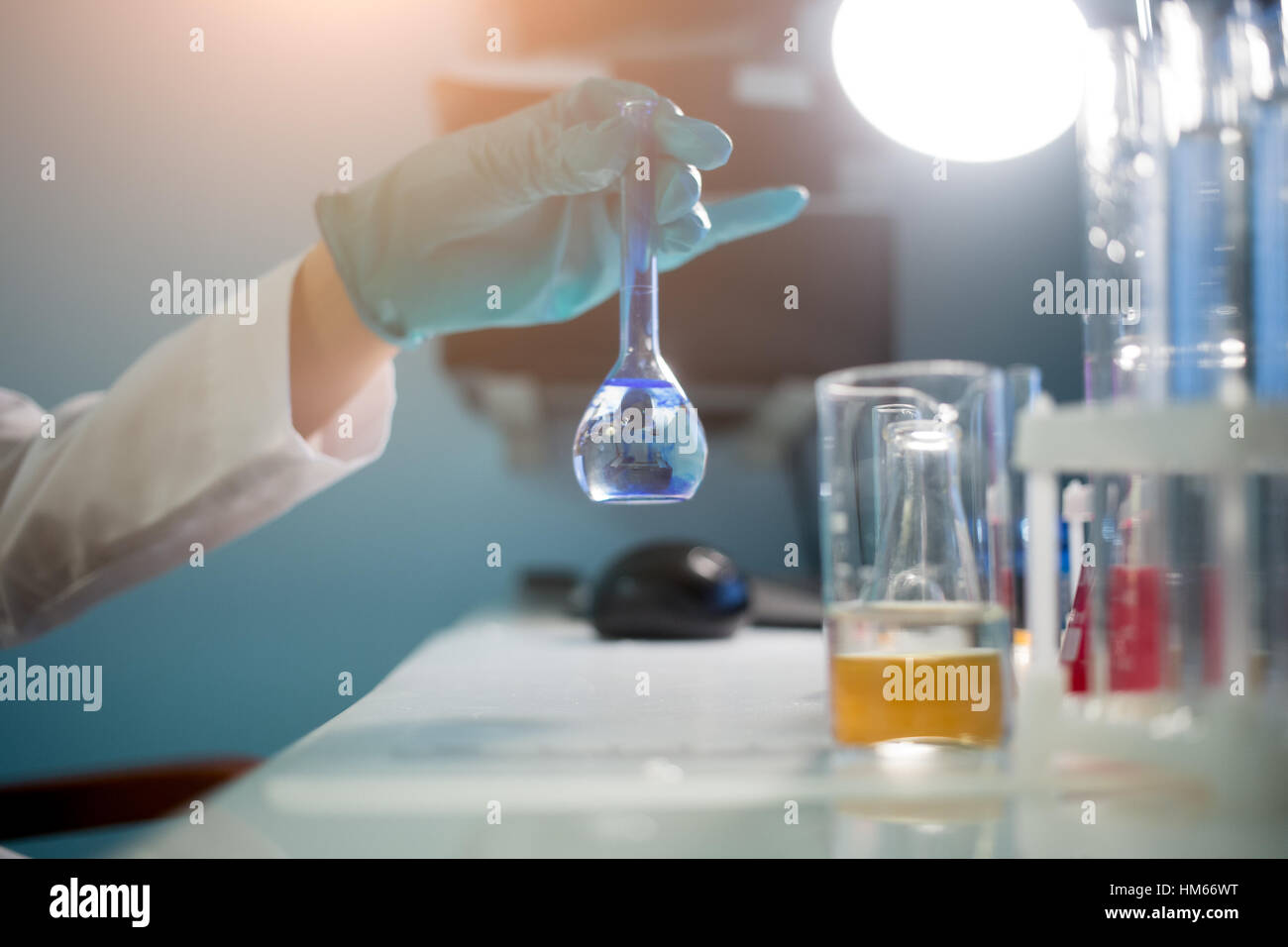 Lab assistant in white coat Stock Photo - Alamy