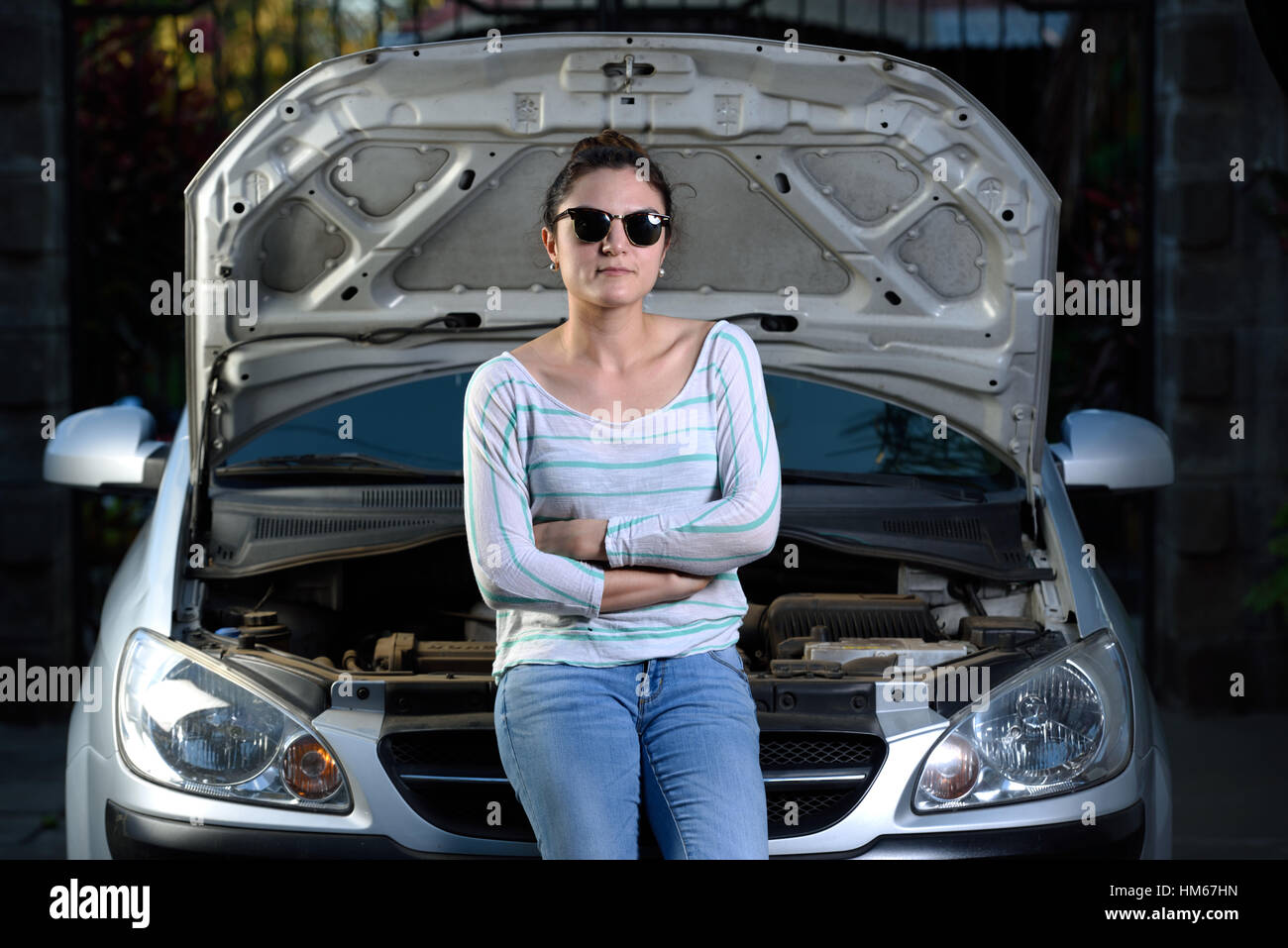 Girl sitting with the engine car door open Stock Photo - Alamy