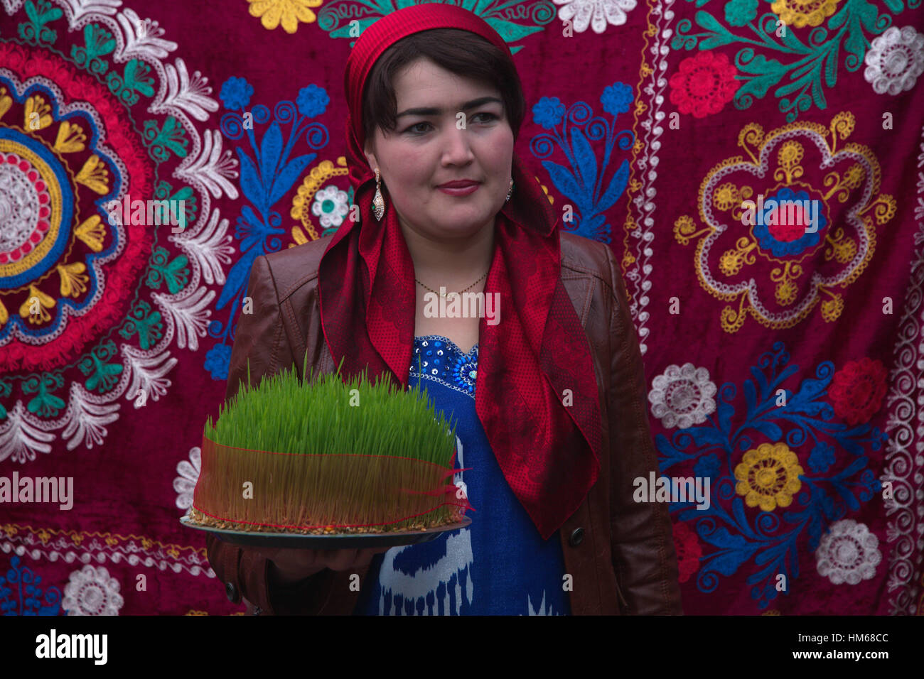 Woman holds growing Seeds (Sabzeh) during celebration Nowruz (Persian ...