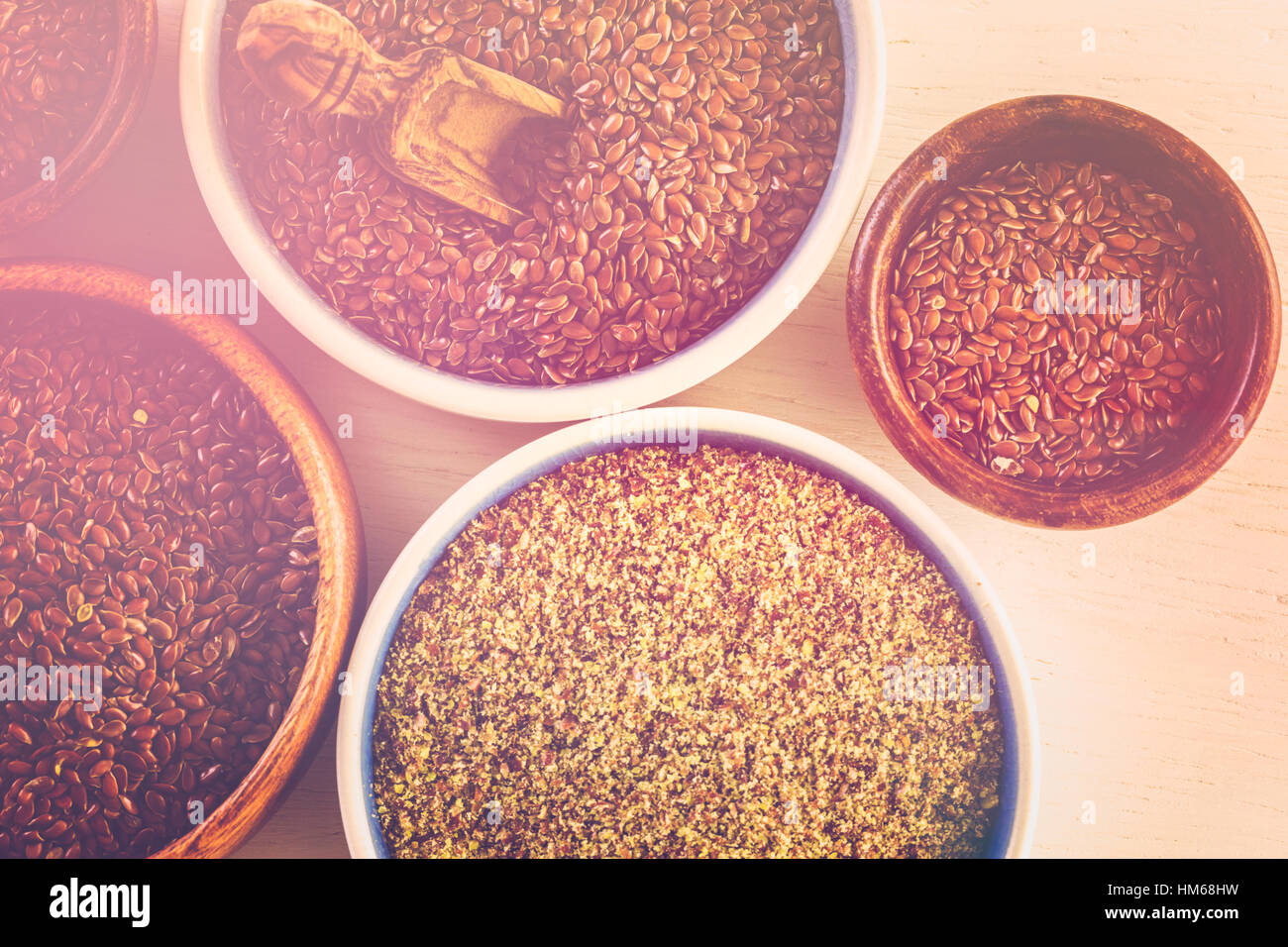 Flax seeds on painted wood board Stock Photo - Alamy