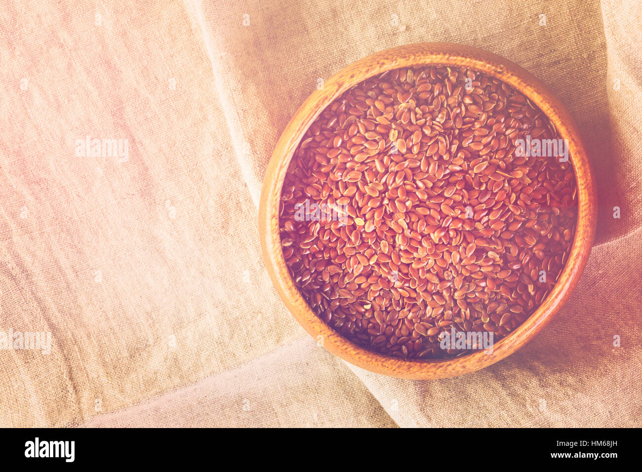 Flax seeds on painted wood board Stock Photo - Alamy