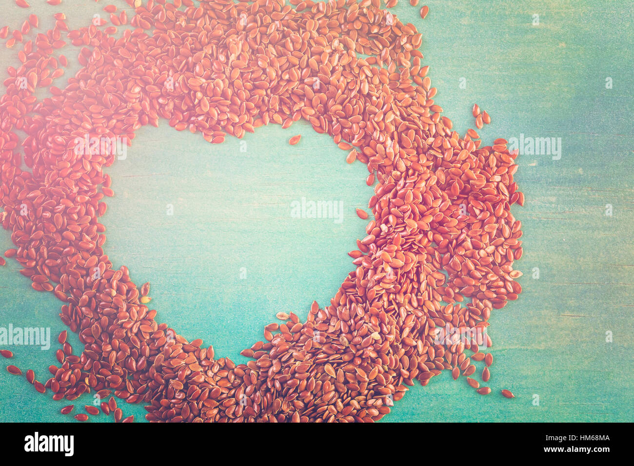 Flax seeds on painted wood board Stock Photo - Alamy