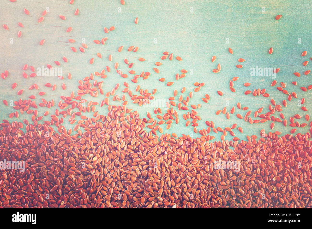 Flax seeds on painted wood board Stock Photo - Alamy