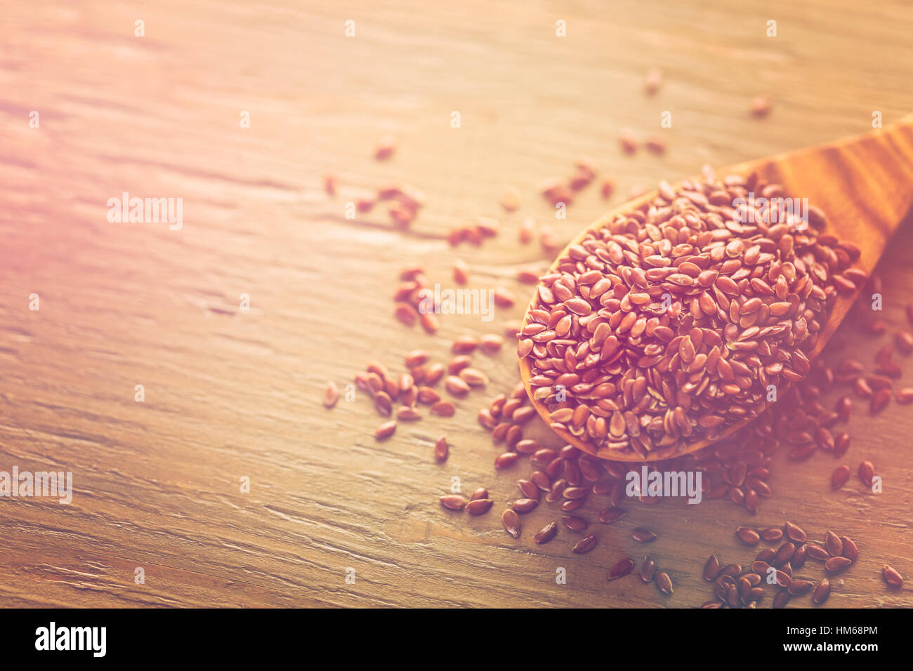 Flax seeds on painted wood board Stock Photo - Alamy