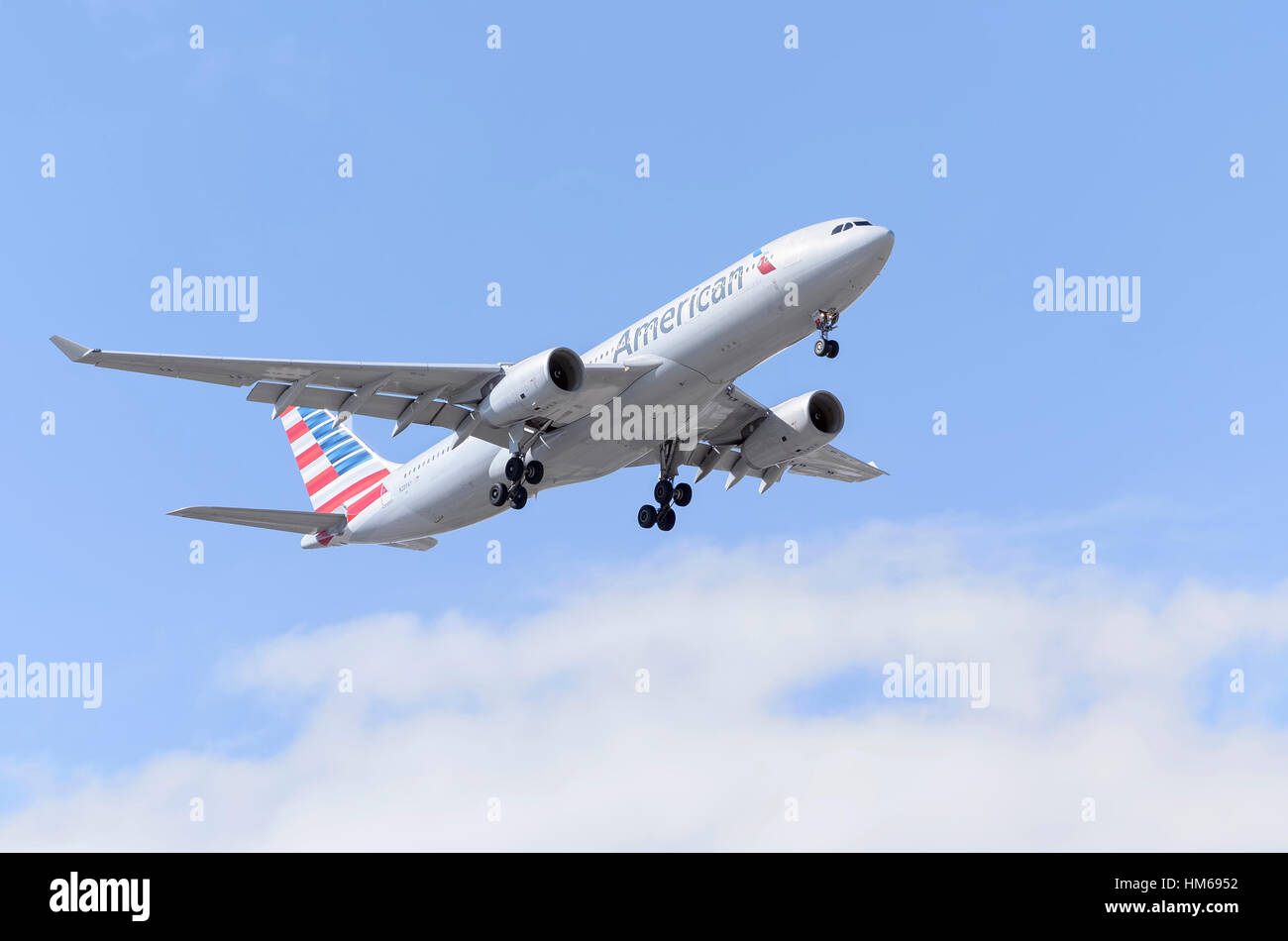 Airplane Airbus A330, of American Airlines airline. Blue sky with some ...