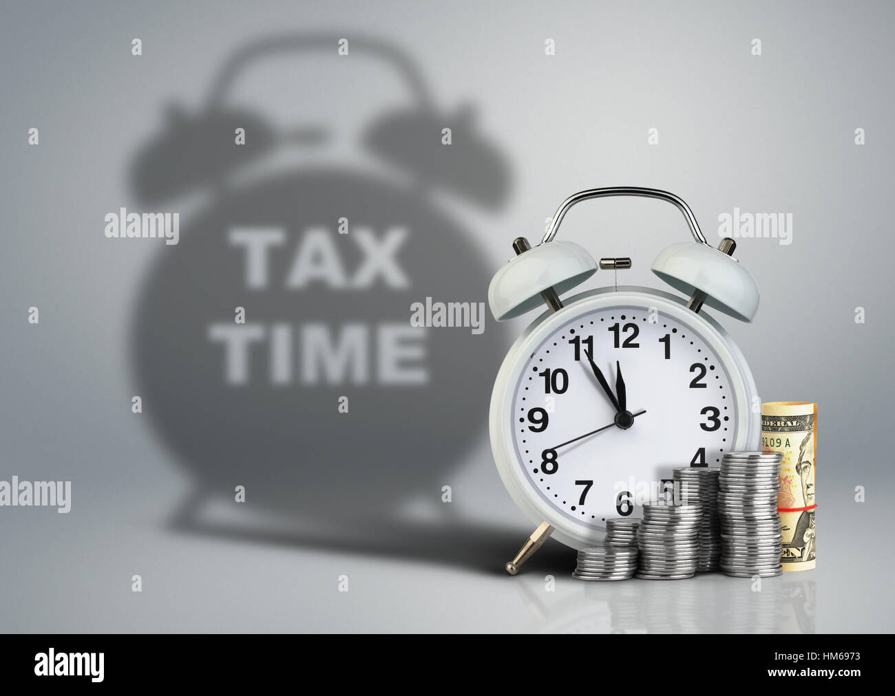 Clock with money and tax time shadow, financial concept Stock Photo - Alamy