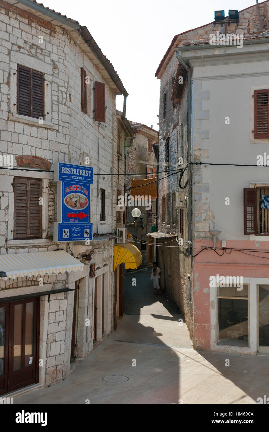 UMAG, CROATIA - AUGUST 15: View of narrow medieval street with ...