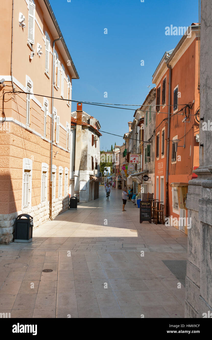 UMAG, CROATIA - AUGUST 15: Pedestrians walk along medieval street in ...