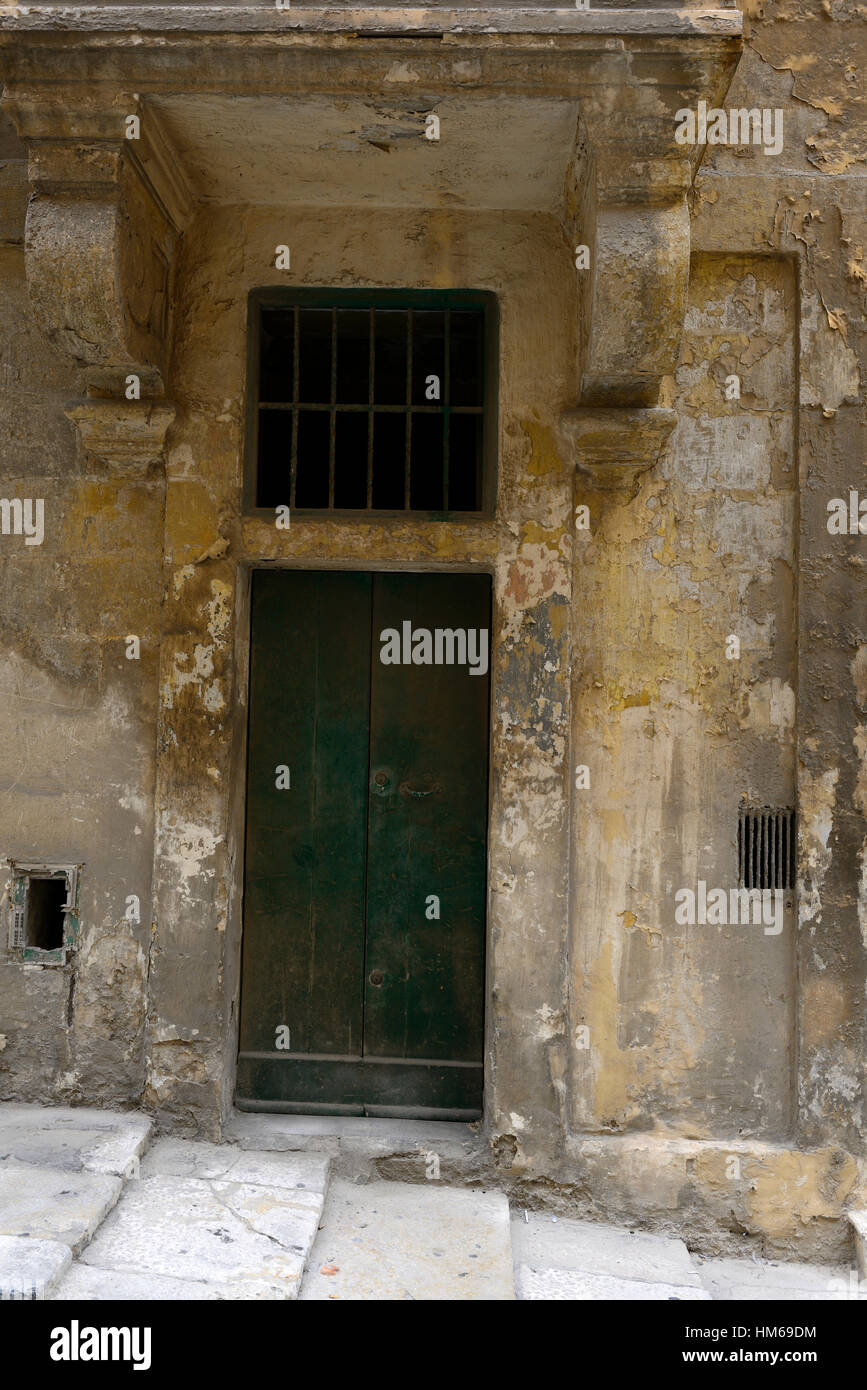Old door doorway dilapidated run down untended decrepit Valletta Malta ...