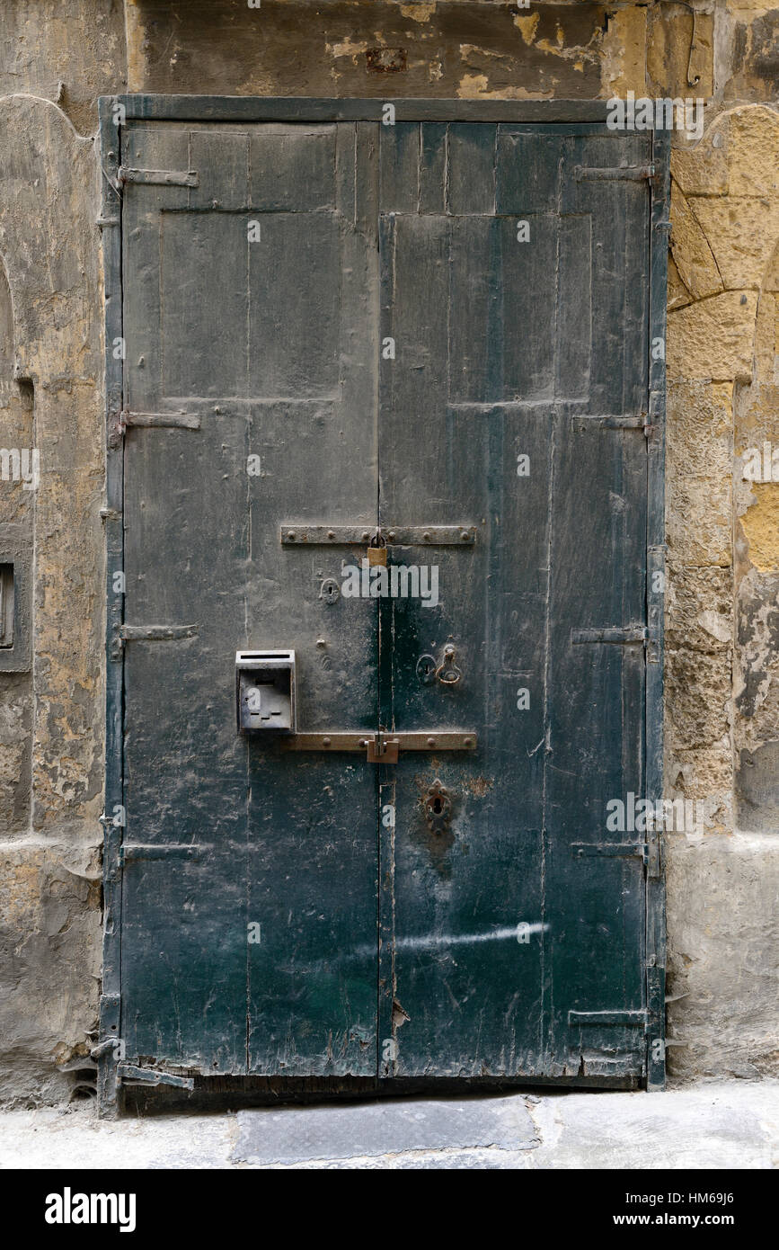 Old door doorway dilapidated run down untended decrepit Valletta Malta ...