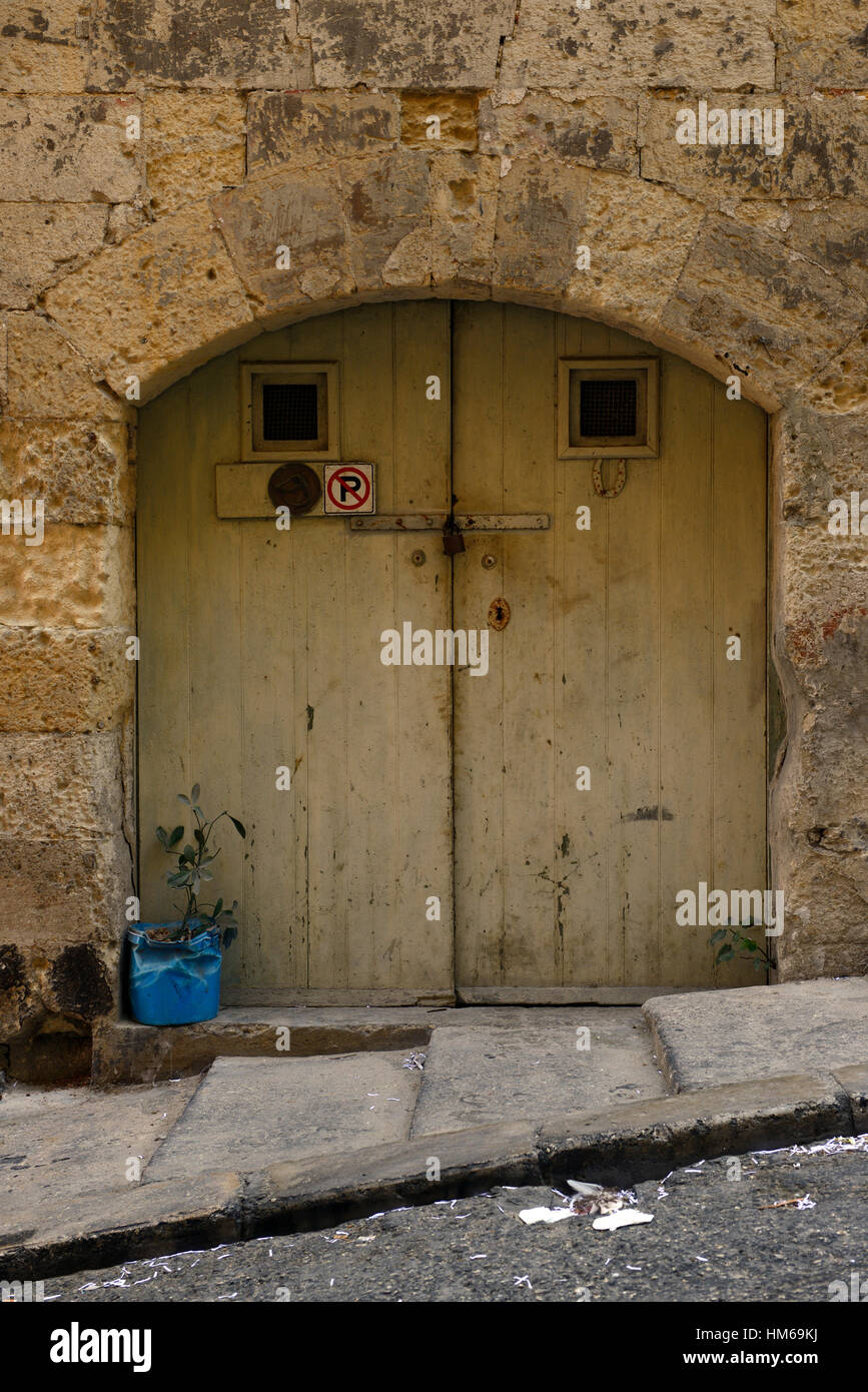 Old door doorway dilapidated run down untended decrepit Valletta Malta ...