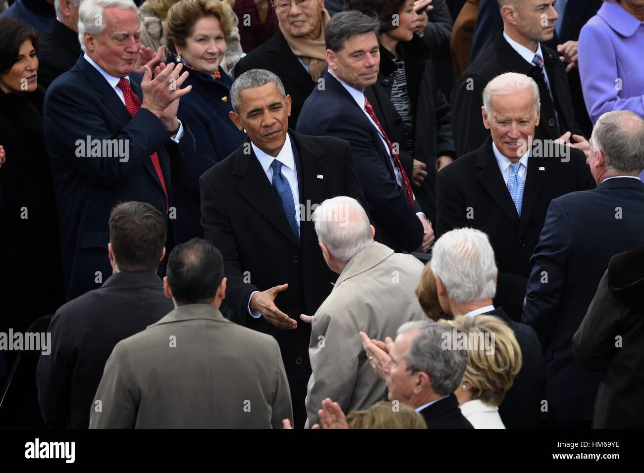 President Barack Obama greets former President Jimmy Carter after he ...