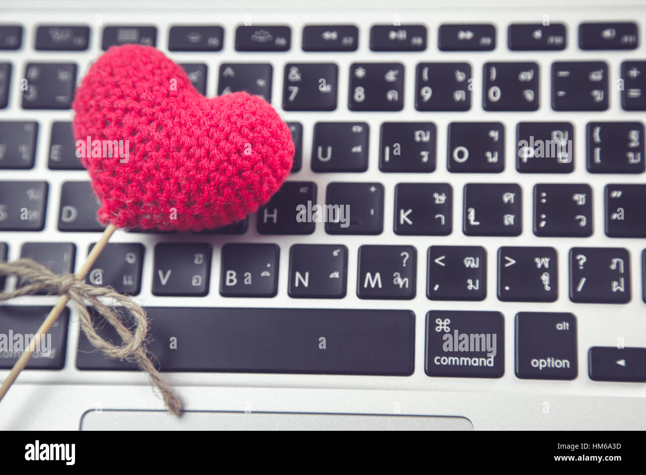 laptop keyboard top view with red love heart vintage color tone, love ...