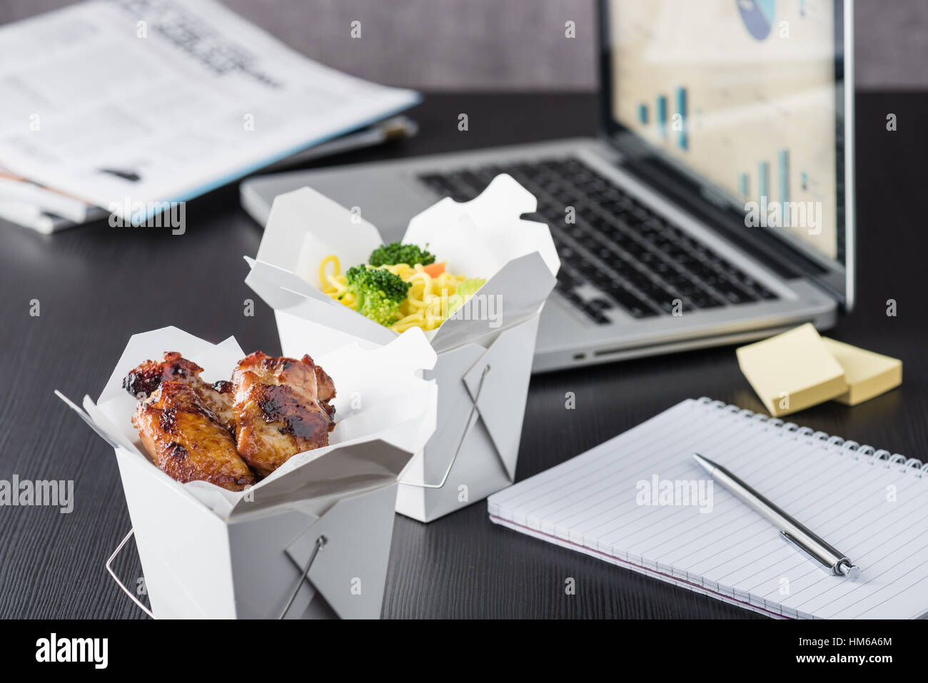 Chicken wings and noodles in noodles box at office lunch Stock Photo ...