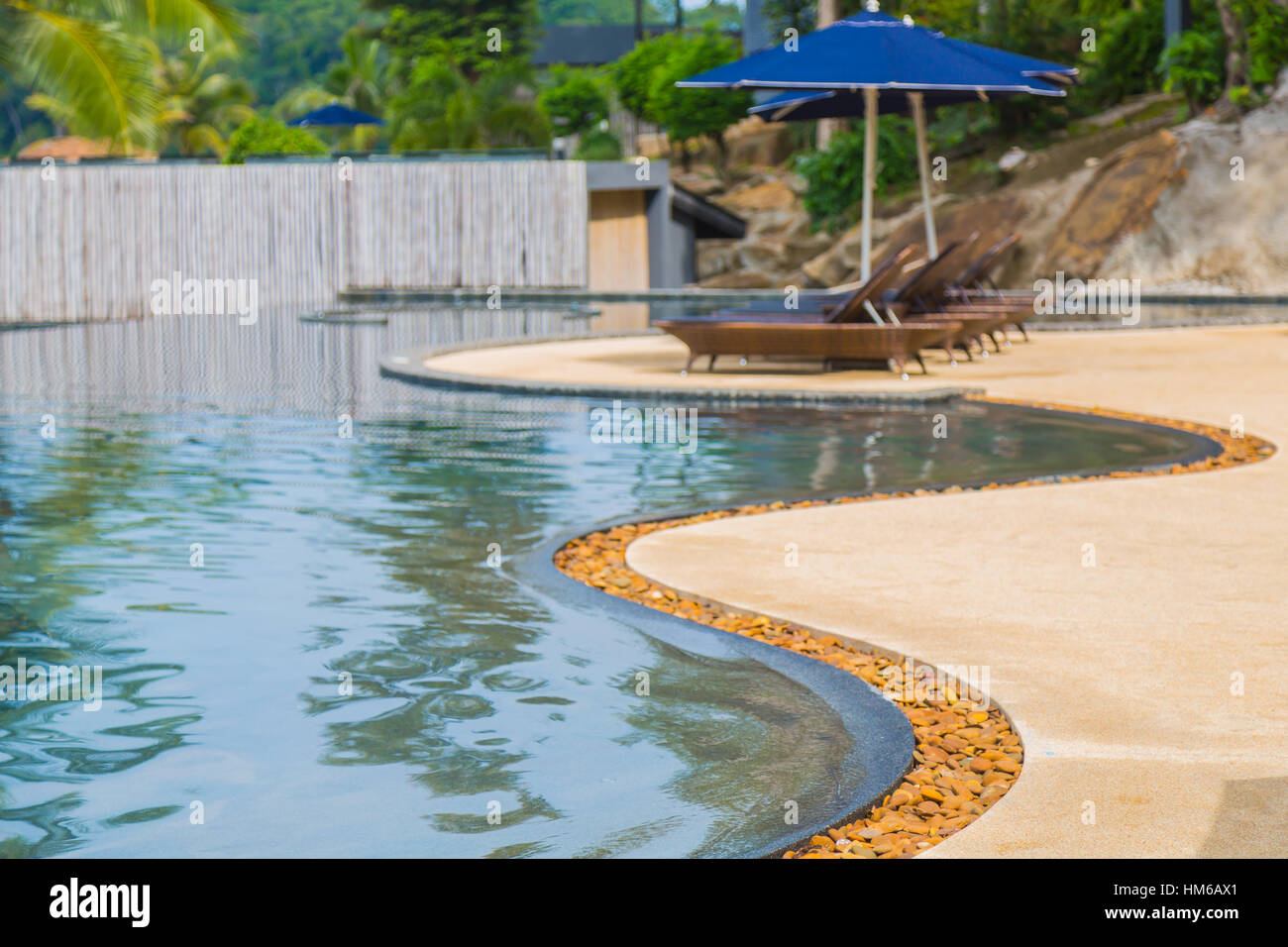 Swimming pool with relaxing seats Stock Photo - Alamy