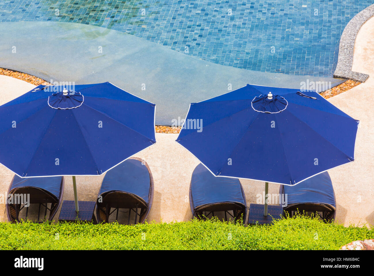 Swimming pool with relaxing seats Stock Photo - Alamy