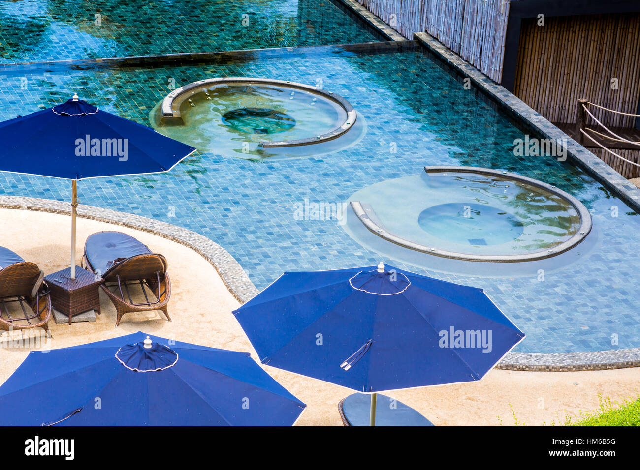 Swimming pool with relaxing seats Stock Photo - Alamy