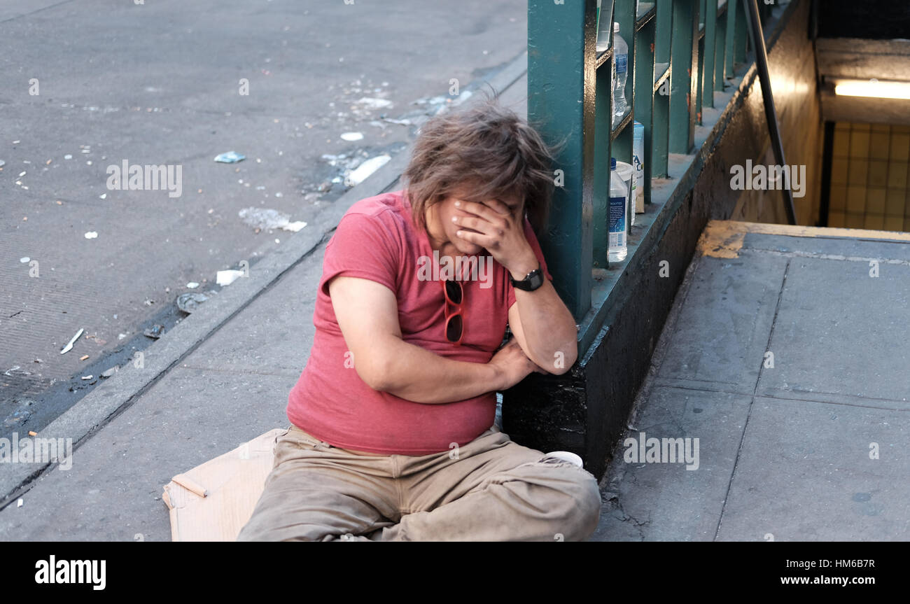Adult male seen slumped by a New York subway in early October Stock ...