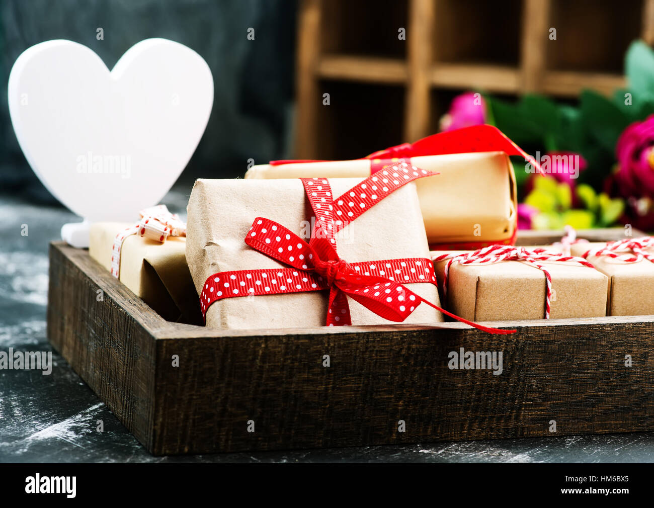 heart and boxes for present on a table Stock Photo - Alamy