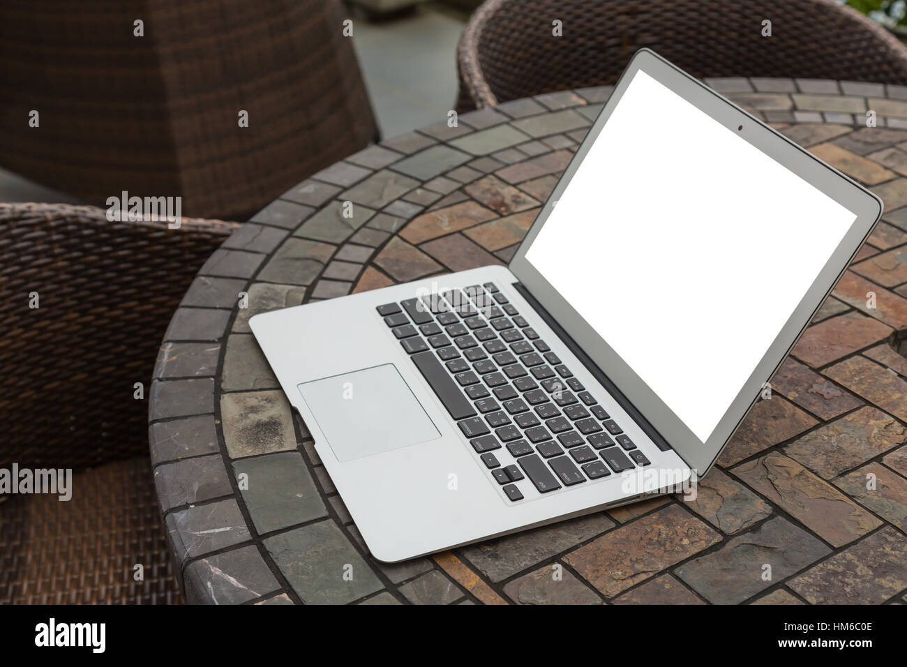 Blank screen laptop computer on table Stock Photo - Alamy