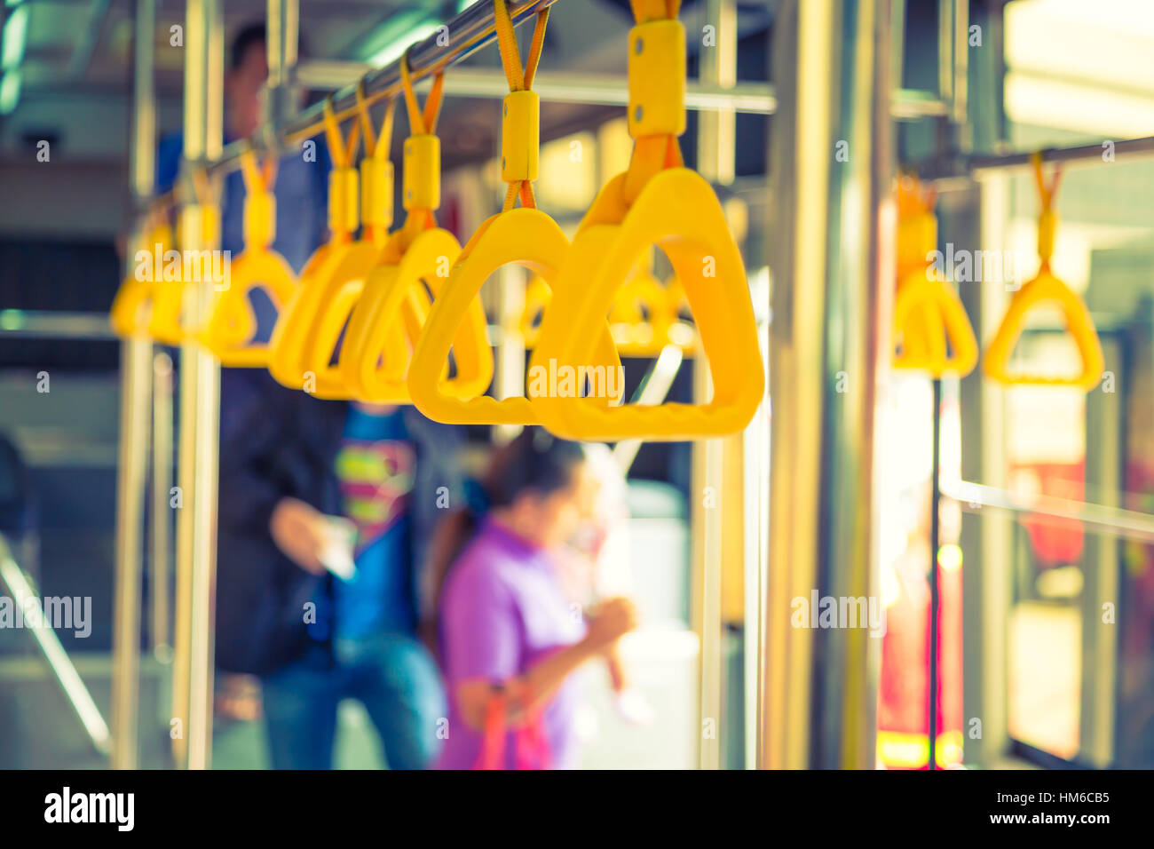 Handles passenger inside a bus. ( Filtered image processed vintage ...