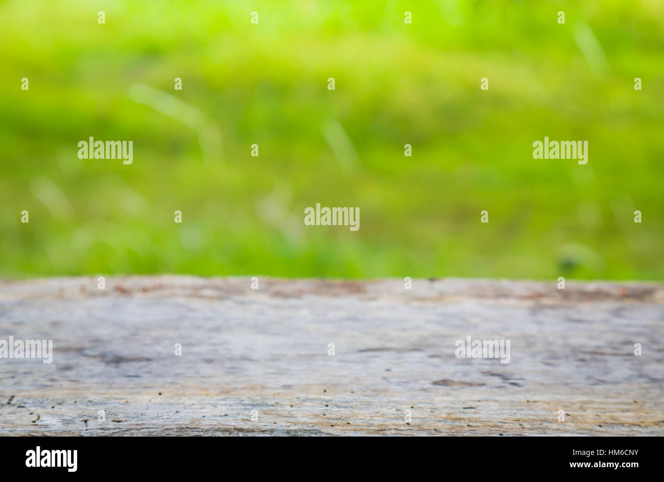 Empty wooden table on garden Stock Photo - Alamy