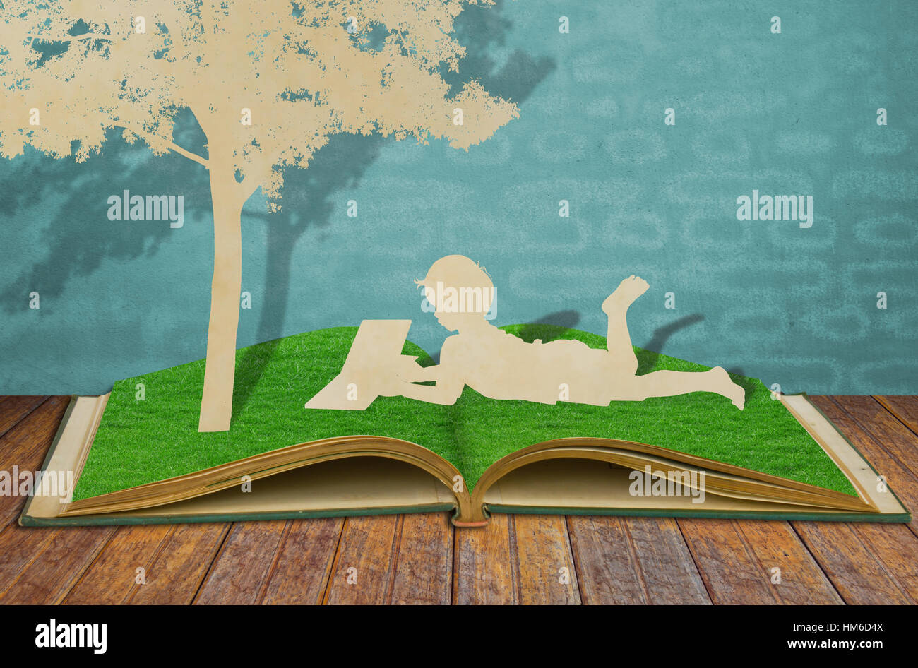 Children reading books under tree hi-res stock photography and images ...
