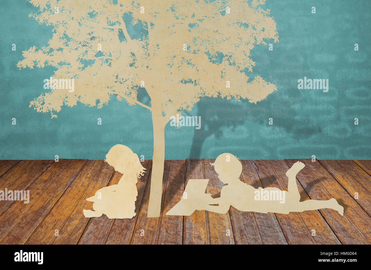 Children reading books under tree hi-res stock photography and images ...