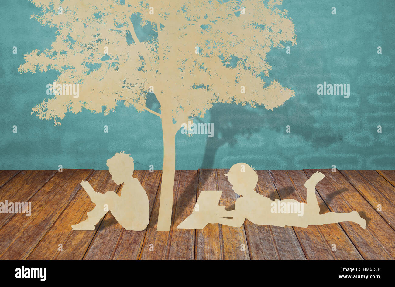 Children reading books under tree hi-res stock photography and images ...
