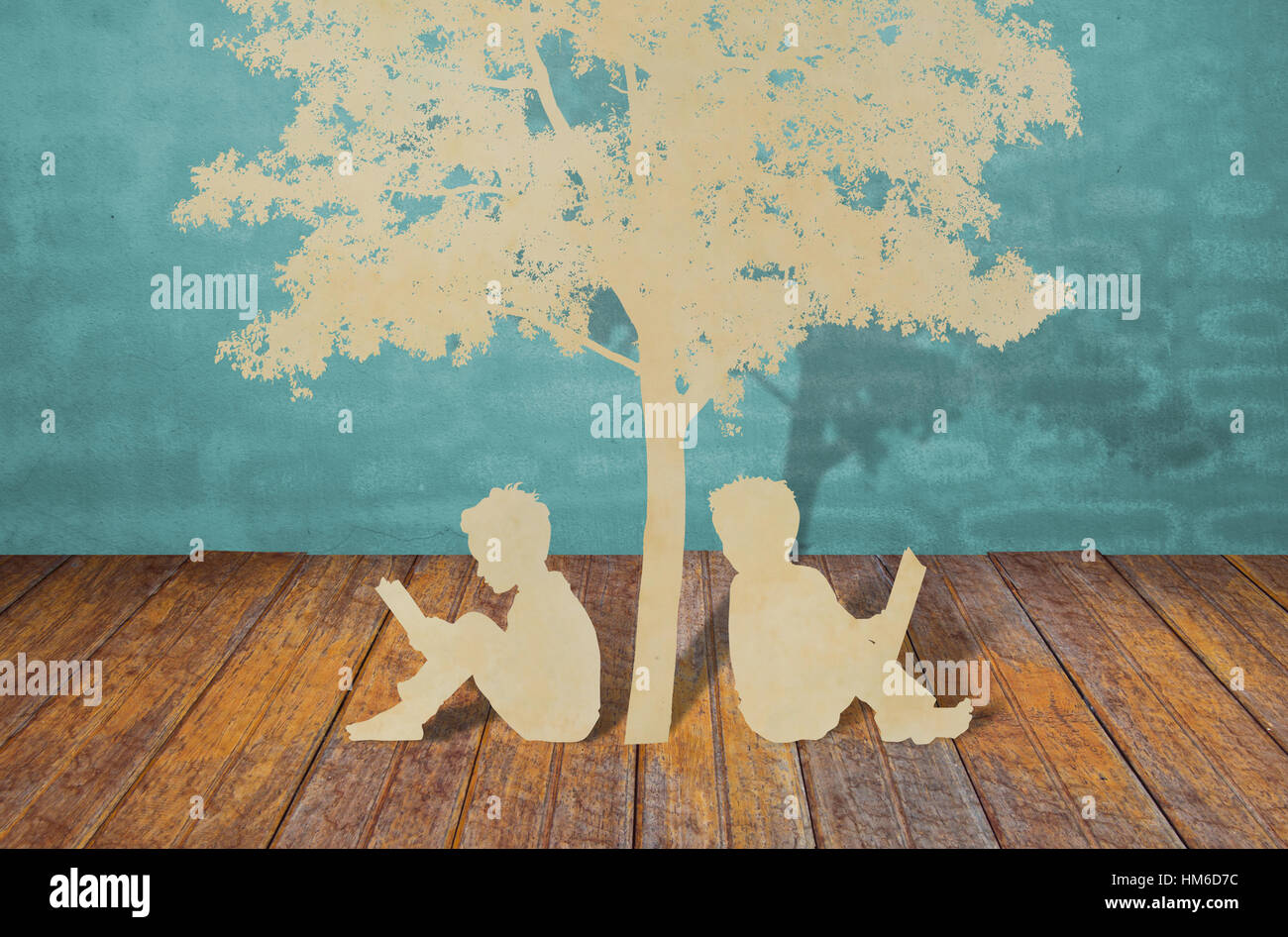 Children reading books under tree hi-res stock photography and images ...