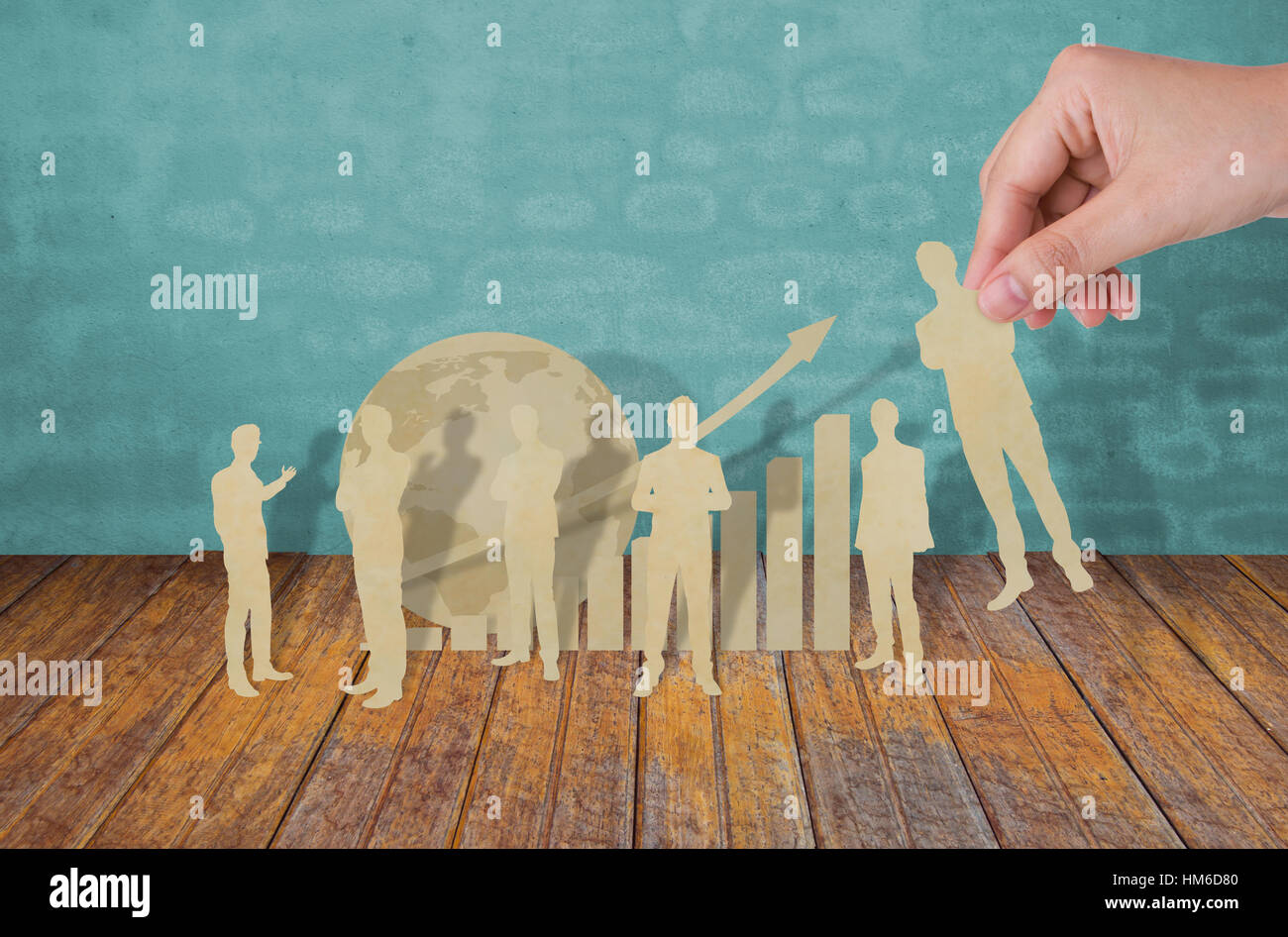 Hand pick paper cut of business man Stock Photo - Alamy