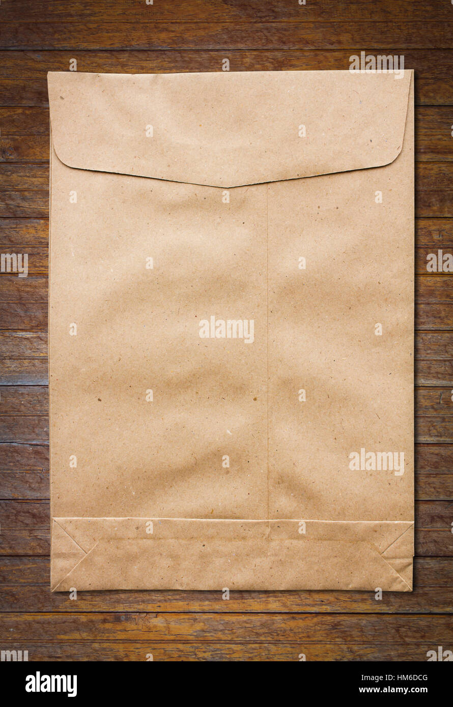 Paper Envelope on wood wall Stock Photo - Alamy