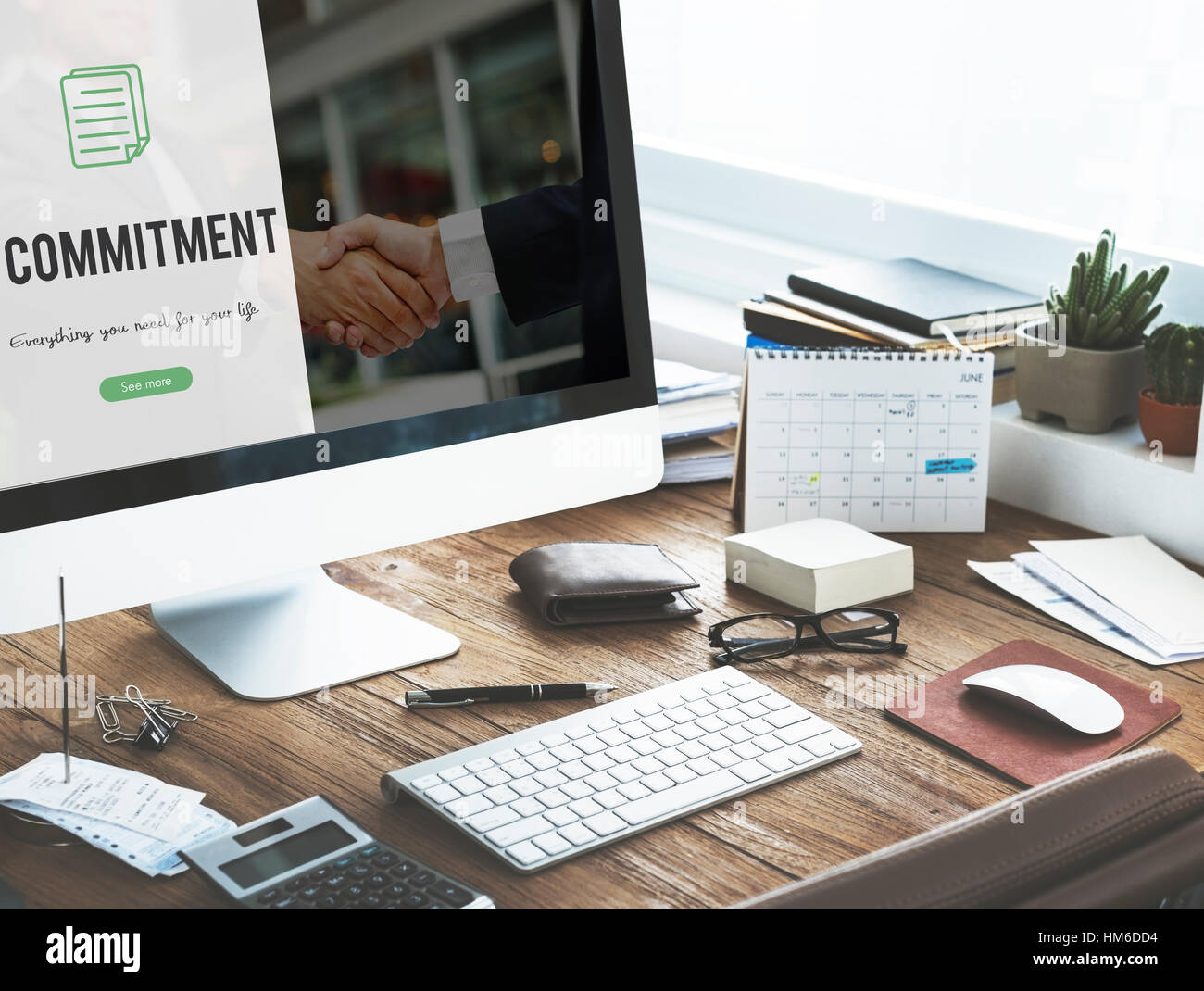 Commitment word on business handshake background Stock Photo - Alamy