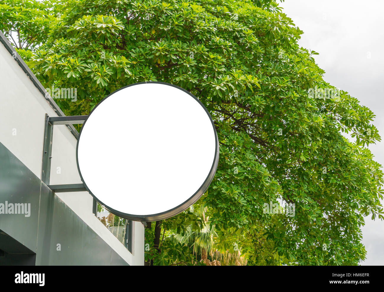 Round shop sign outdoor Stock Photo - Alamy