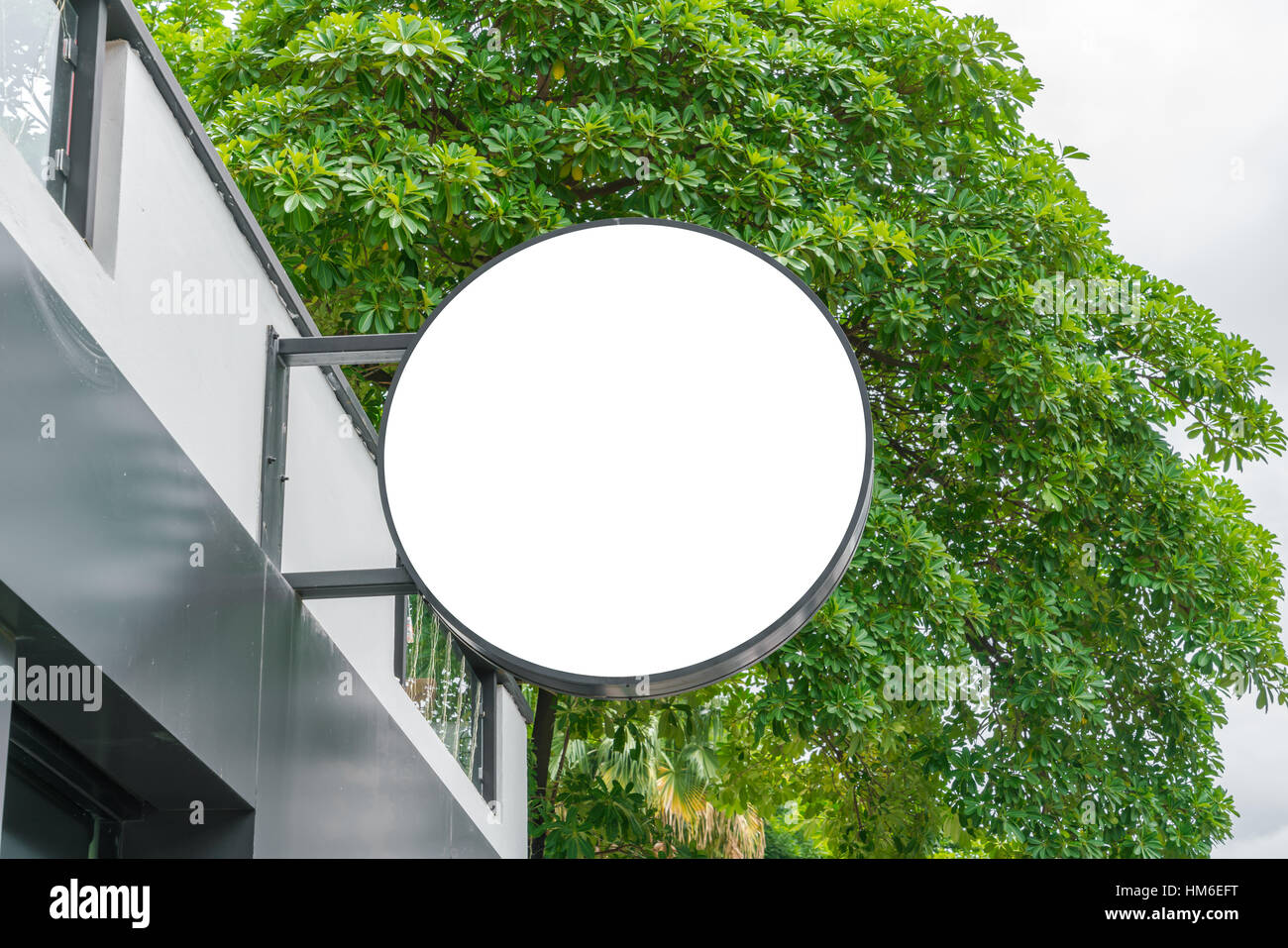 Round shop sign outdoor Stock Photo - Alamy