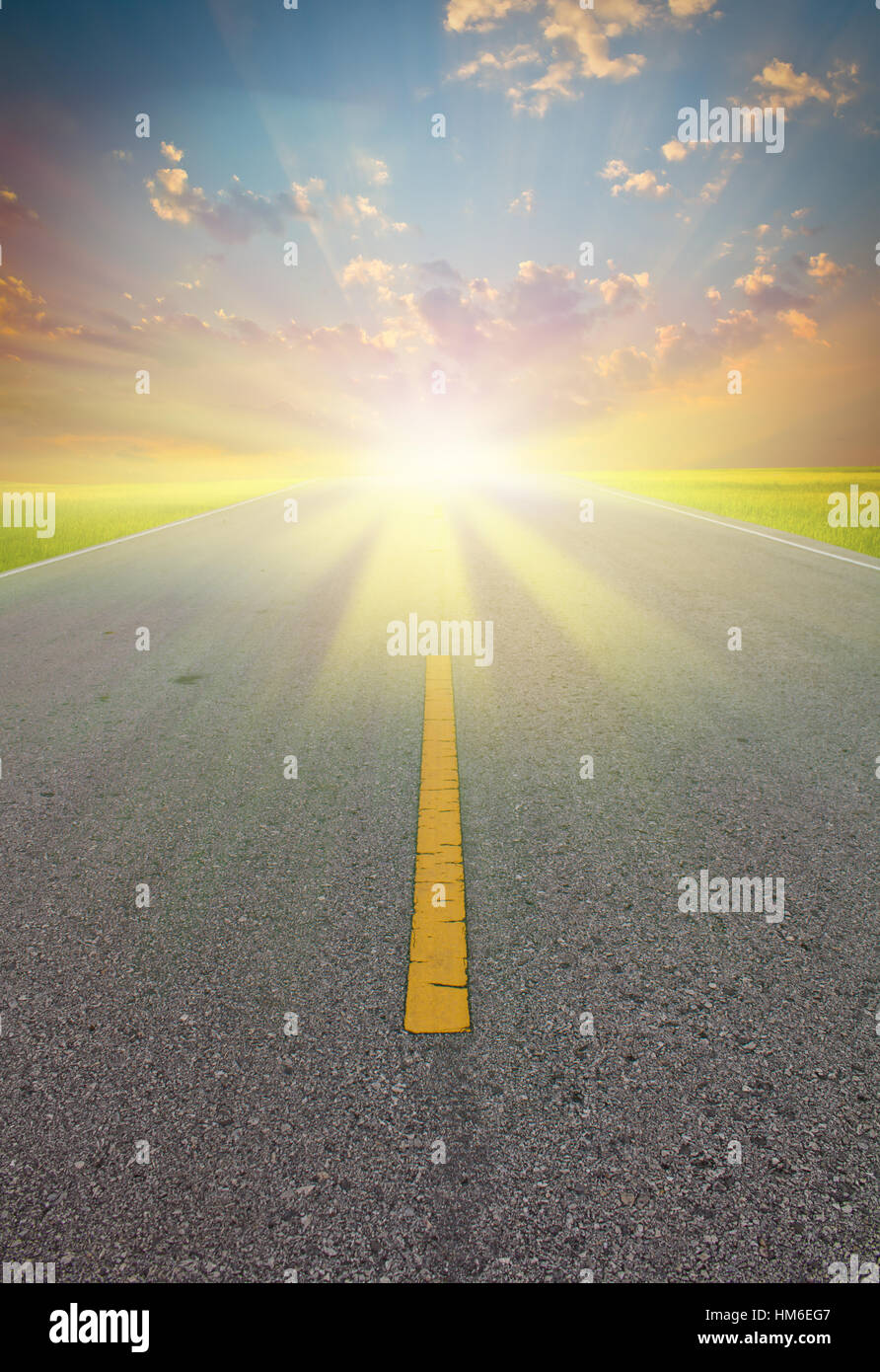 Summer landscape with road and sun Stock Photo - Alamy