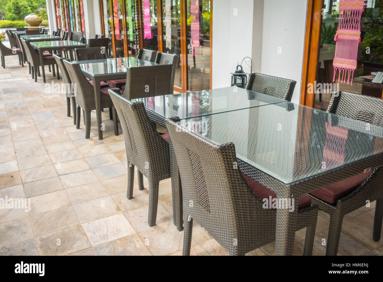 Tables and chairs in restaurant Stock Photo - Alamy