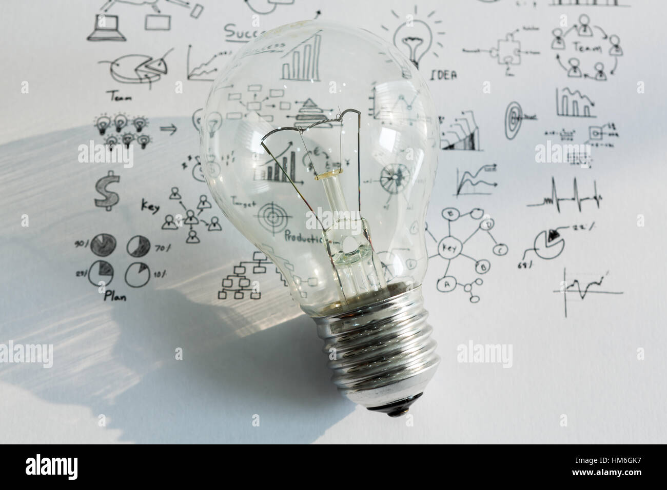 Light bulb with drawing graph Stock Photo - Alamy