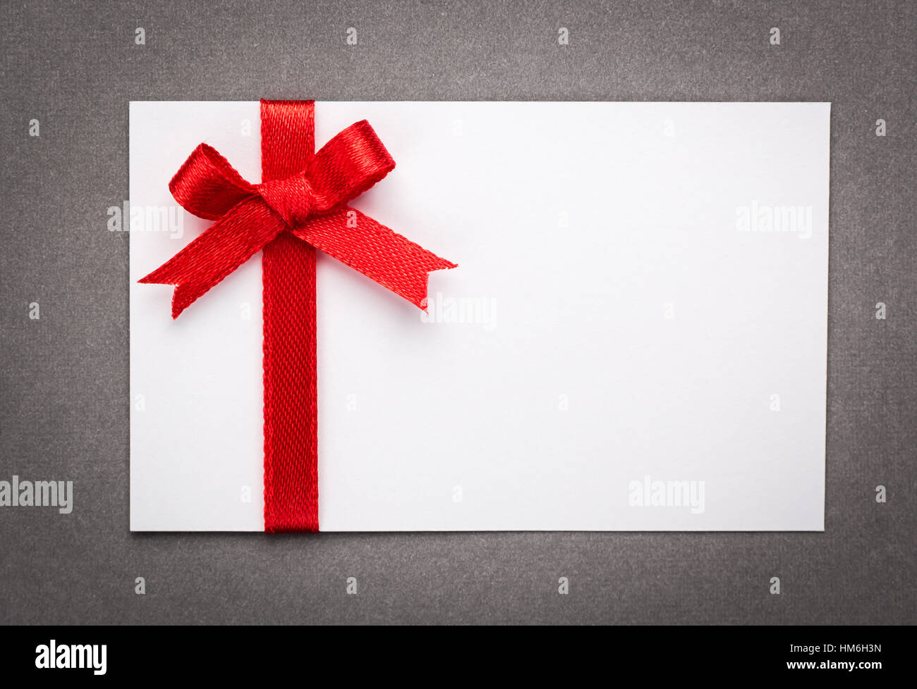 Card with red ribbons bows Stock Photo - Alamy