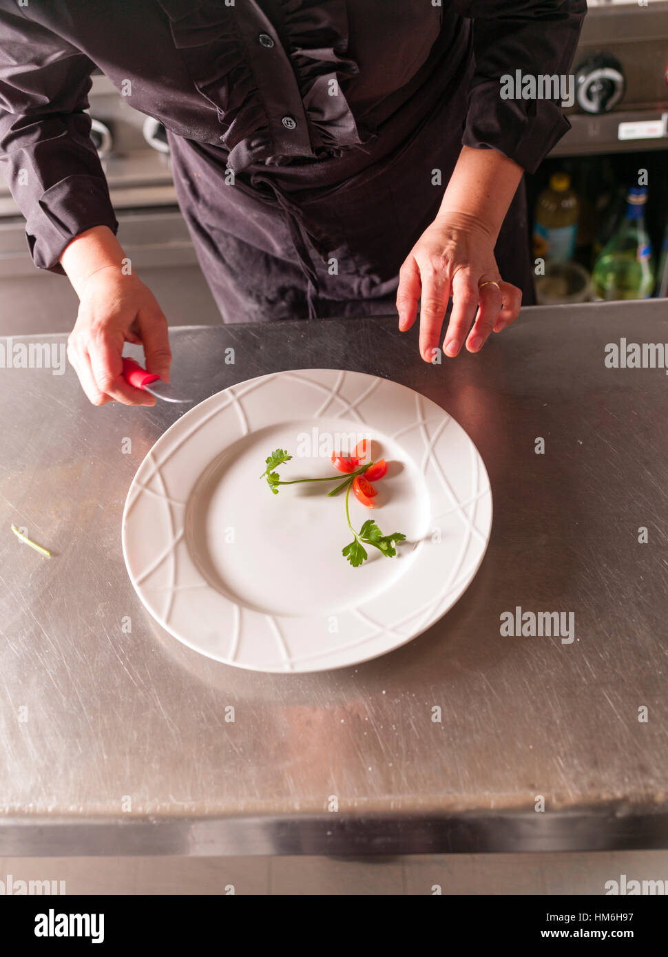 Chef Marina Morelli cooking in her restaurant Hosteria 700, Cremona ...
