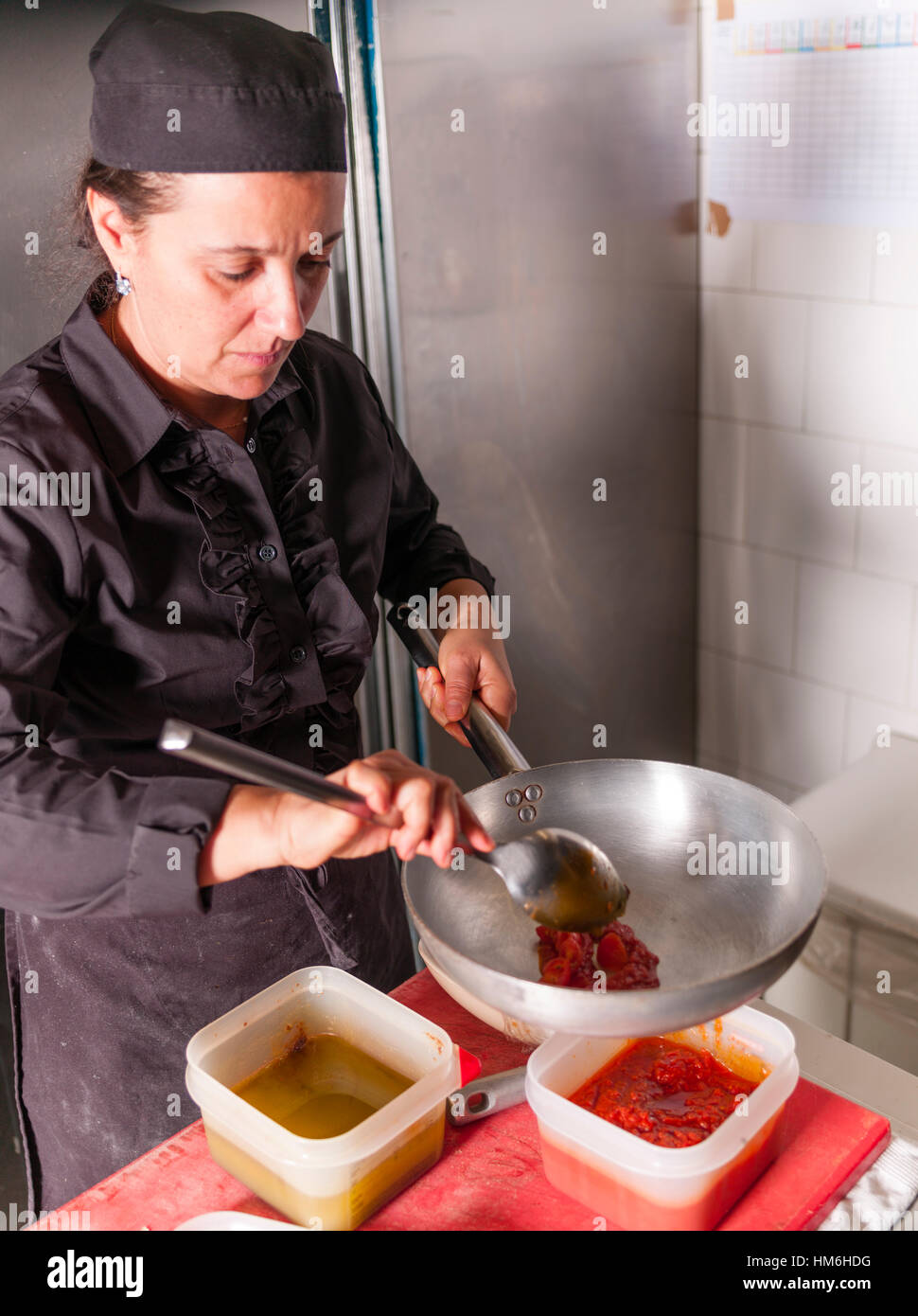 Chef Marina Morelli cooking in her restaurant Hosteria 700, Cremona ...
