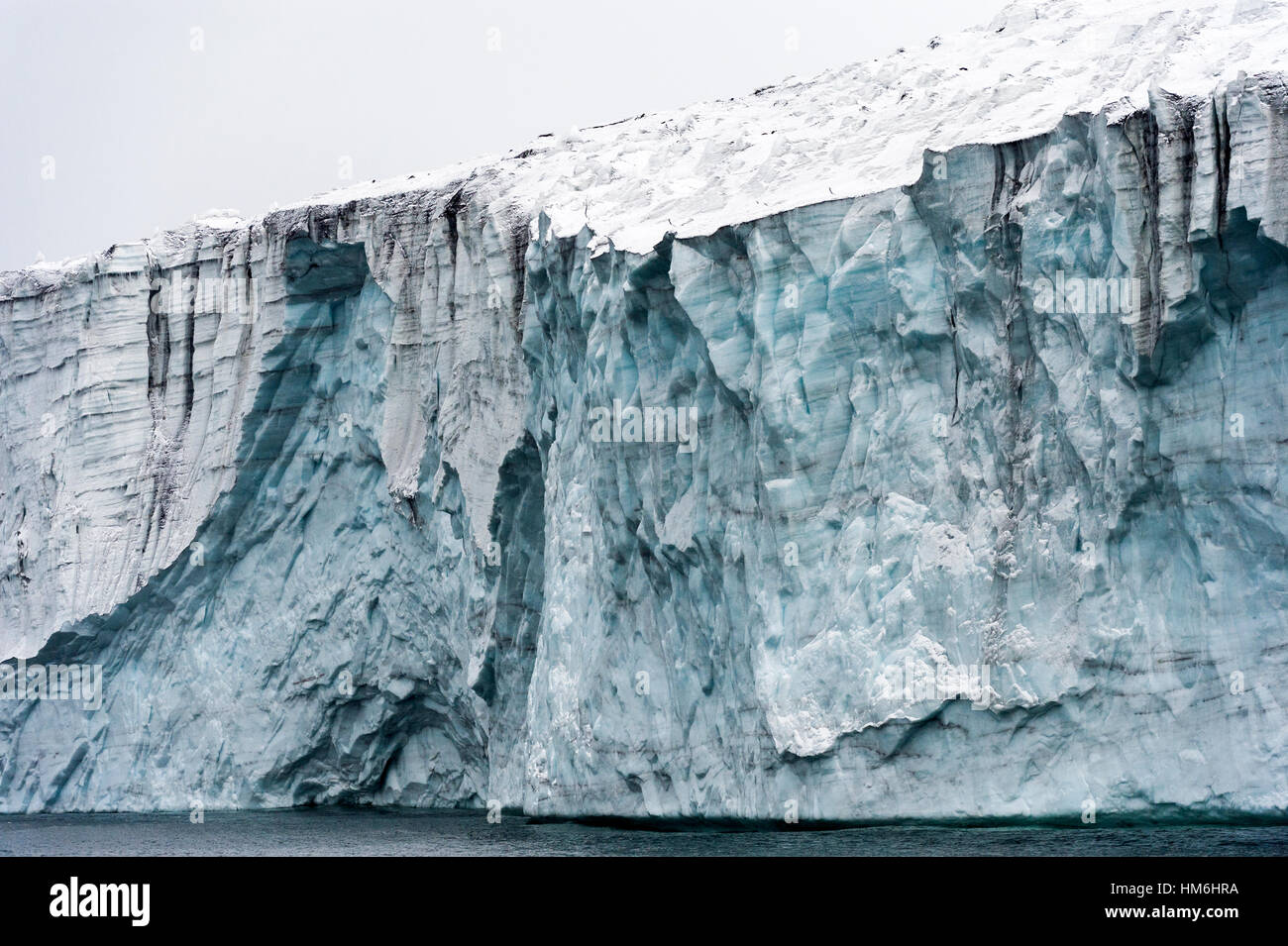 The tortured ice fracture zone of a glacier above the ocean Stock Photo ...