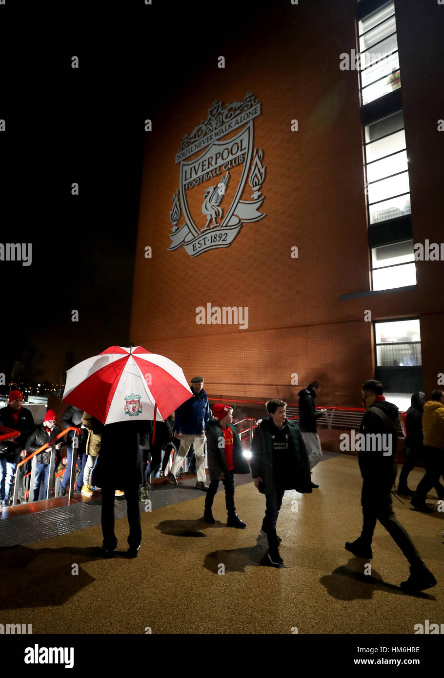 Fans arriving before the Premier League match at the Anfield, Liverpool ...