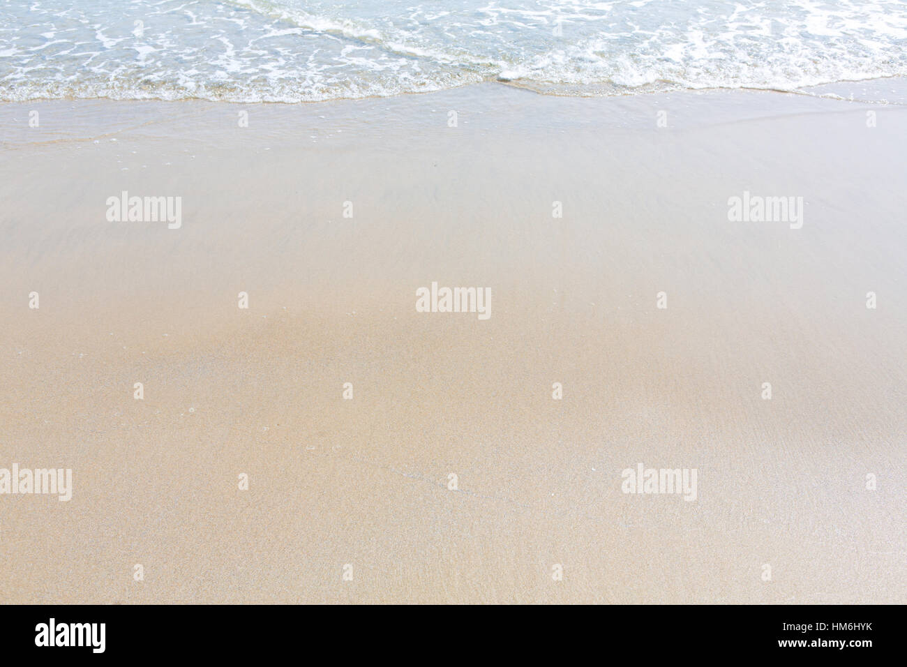 Sand beach water background Stock Photo - Alamy
