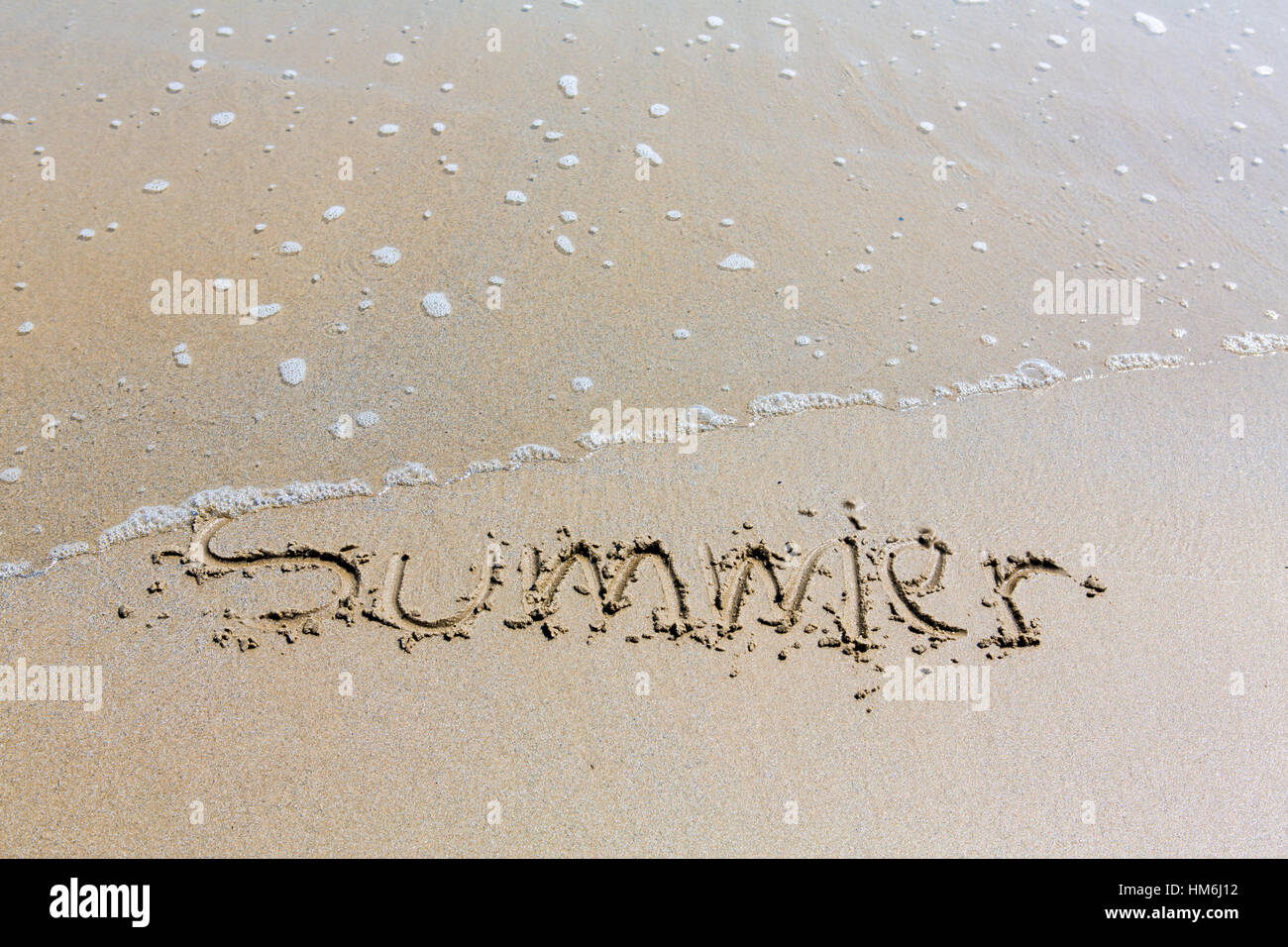 Summer handwritten inscription in sand on a beach Stock Photo - Alamy