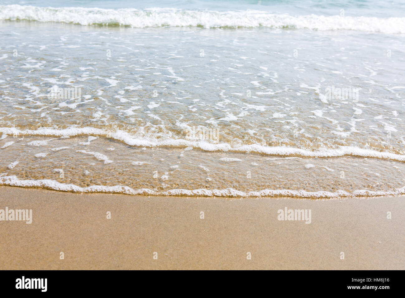 Sand beach water background Stock Photo - Alamy
