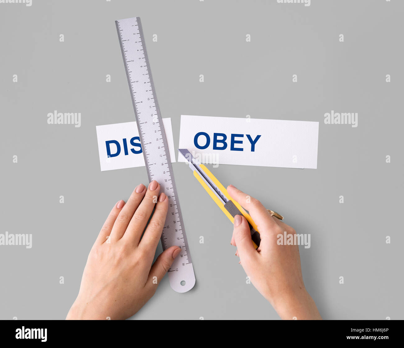 Disobey Hands Word Cut Split Concept Stock Photo - Alamy
