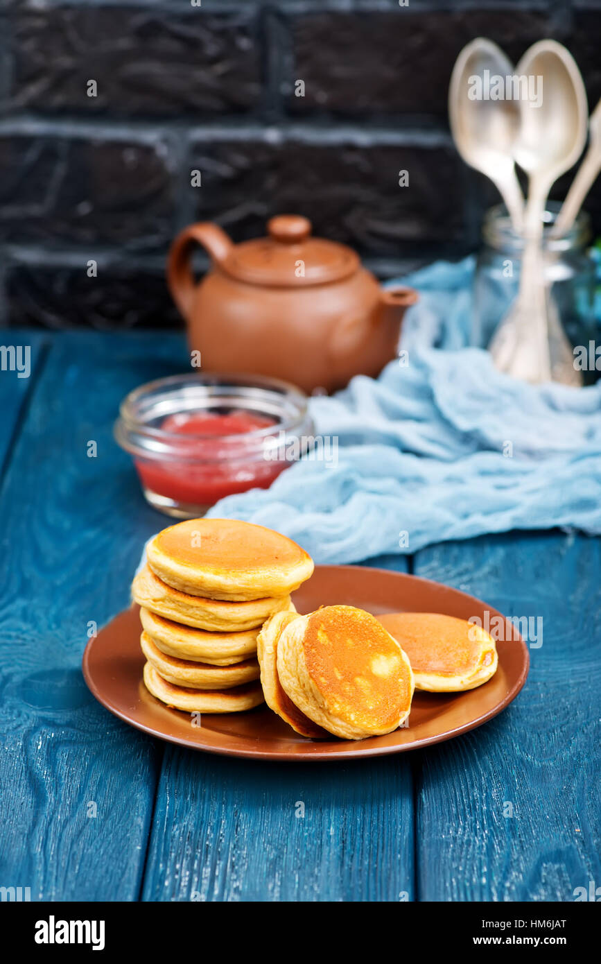 fresh pancakes on plate and on a table Stock Photo - Alamy