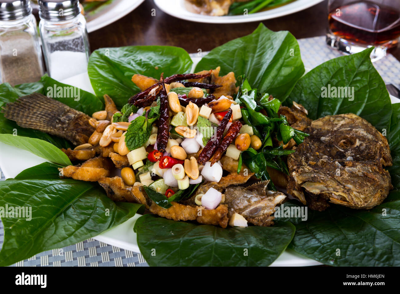 Fried fish with herbs Stock Photo - Alamy