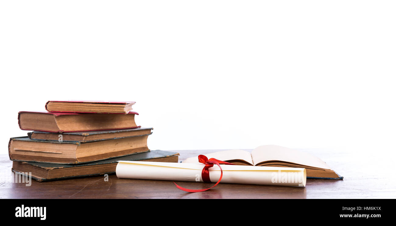 Diploma with old book Stock Photo - Alamy